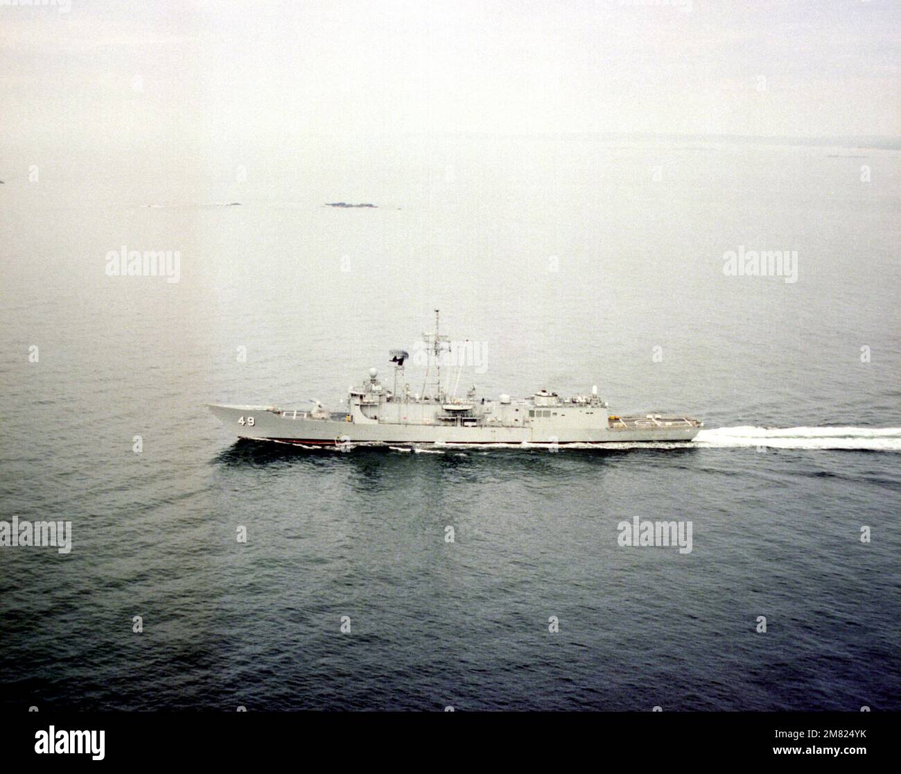An elevated port beam view of the guided missile frigate ROBERT G ...