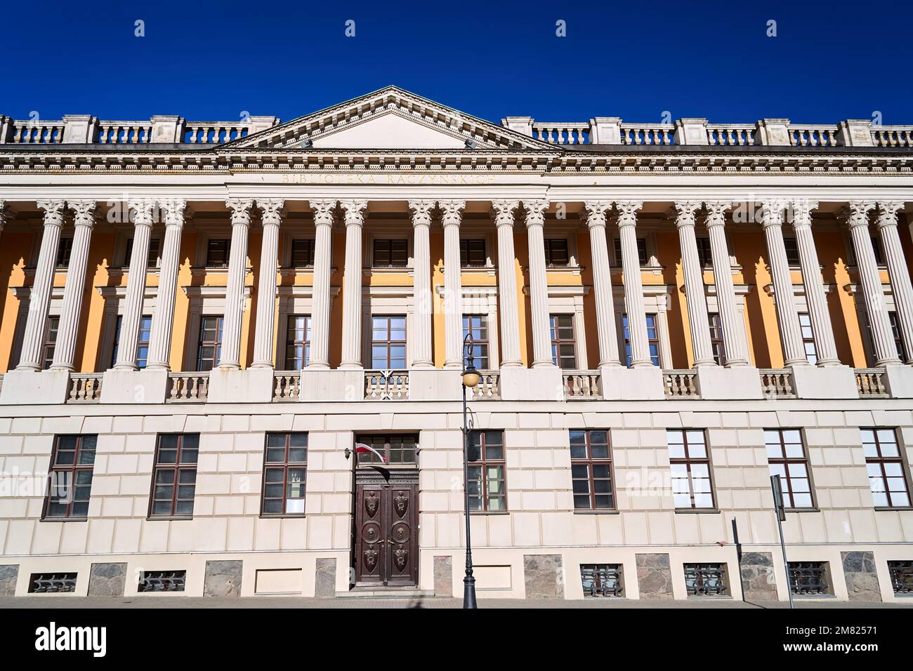 The front facade of the building a public library in Poznan, Poland ...