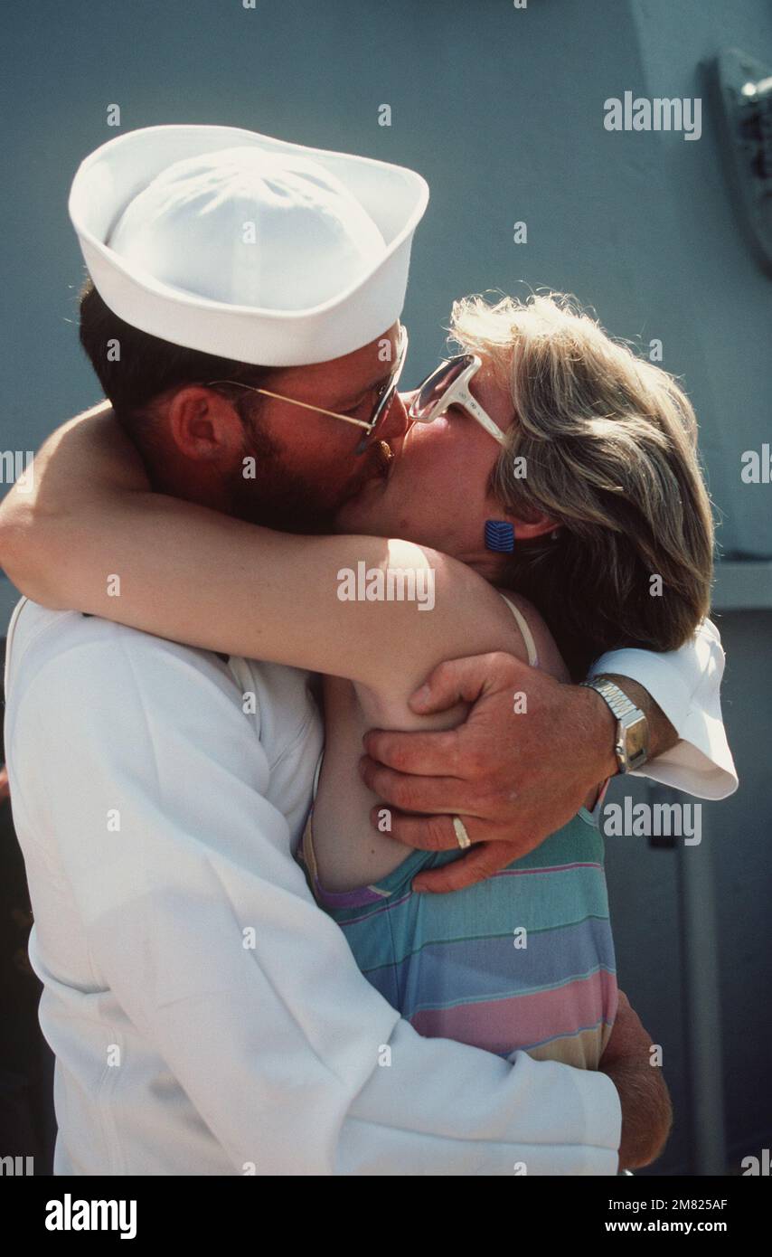 Electrician's Mate 2nd Class (EM2) Brian Pickett hugs his wife, Monnie ...