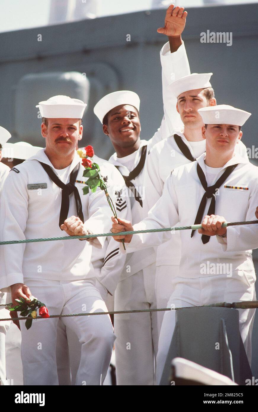 Crewmen aboard the battleship USS NEW JERSEY (BB 62) look for familiar ...