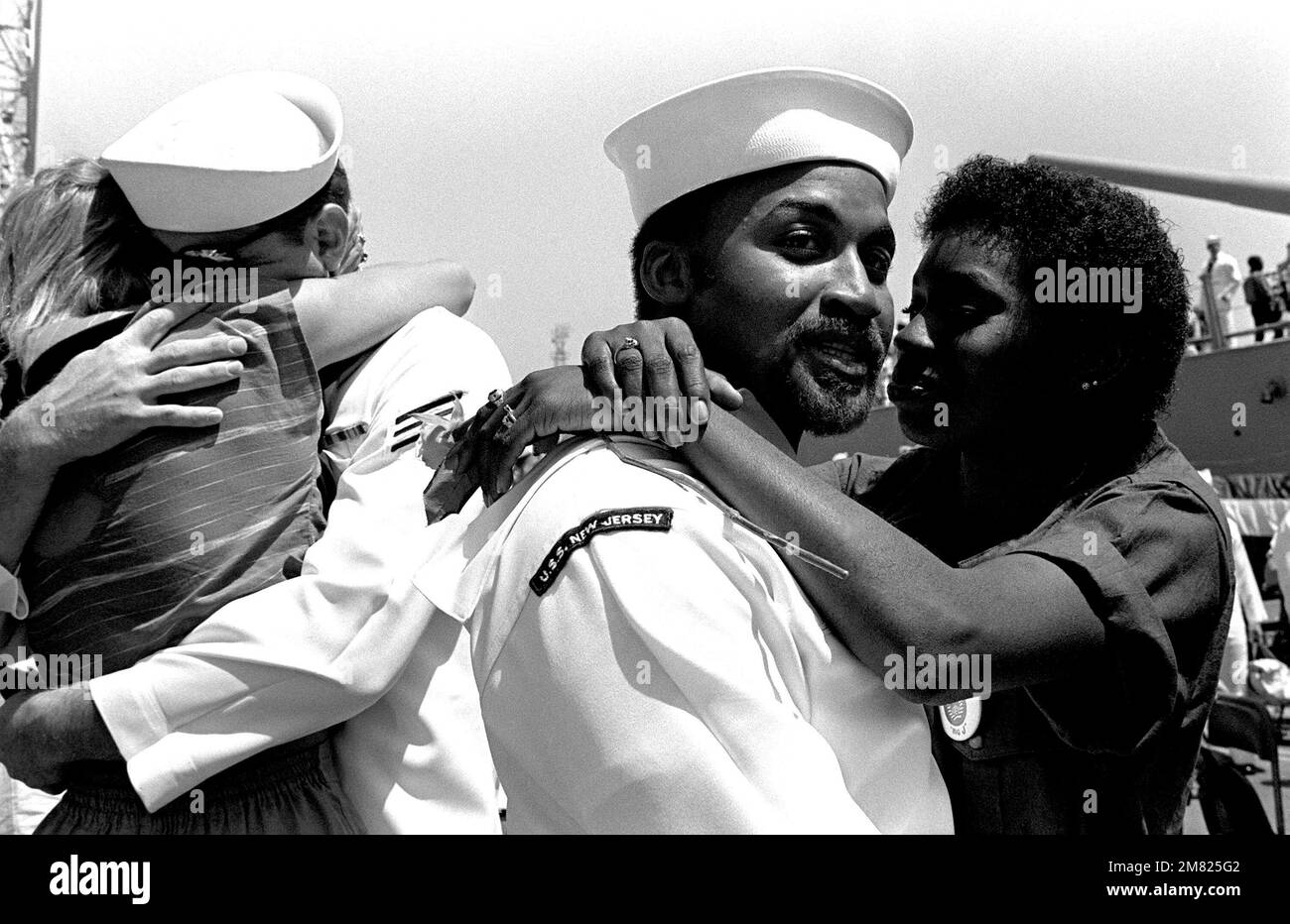 A sailor receives a welcome home hug upon his return to home port after ...