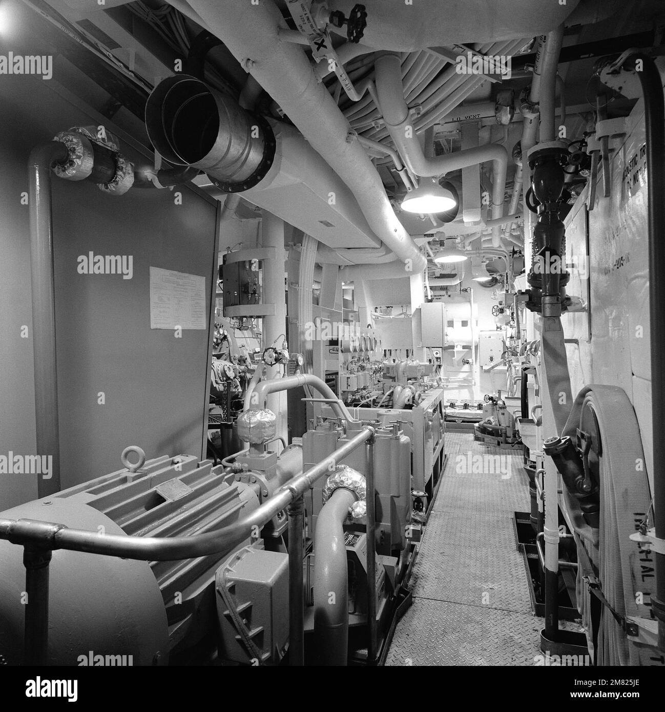 The main engine room of the guided missile frigate RENTZ (FFG 46). The ...
