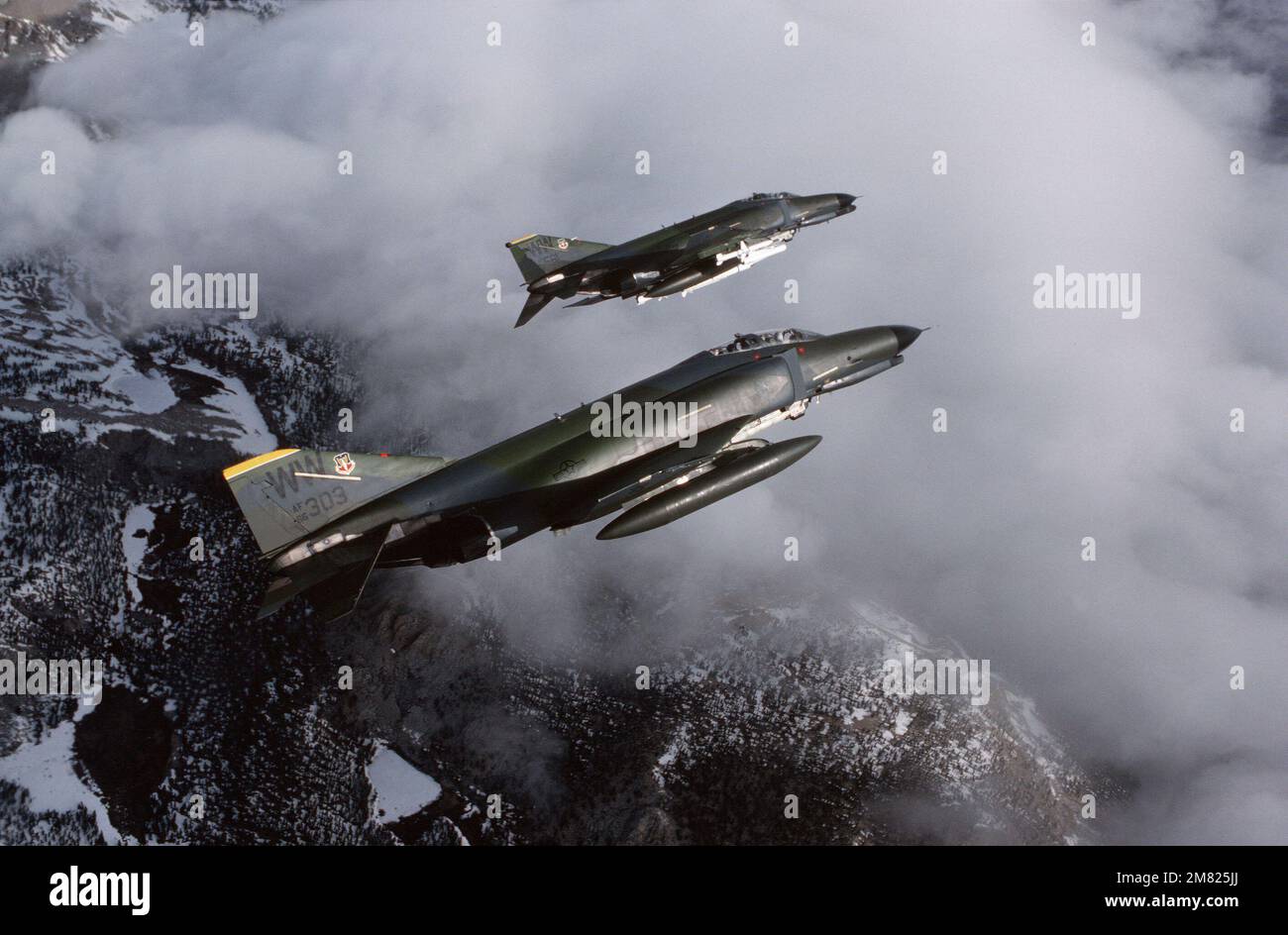 A right side view of an F-4E Phantom II and an F-4G Advanced Wild Weasel Phantom II from the ...