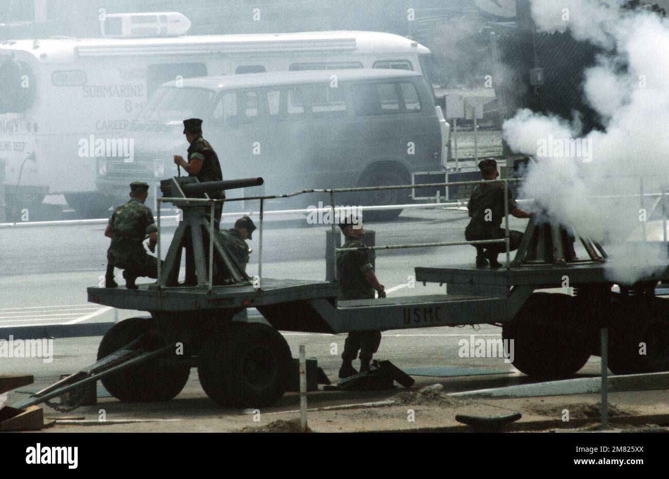 Marines fire a ceremonial cannon salute during the commissioning ...