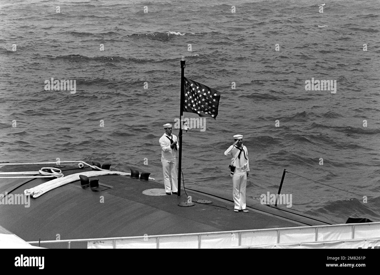 Crew members raise the union jack aboard the nuclear-powered attack ...
