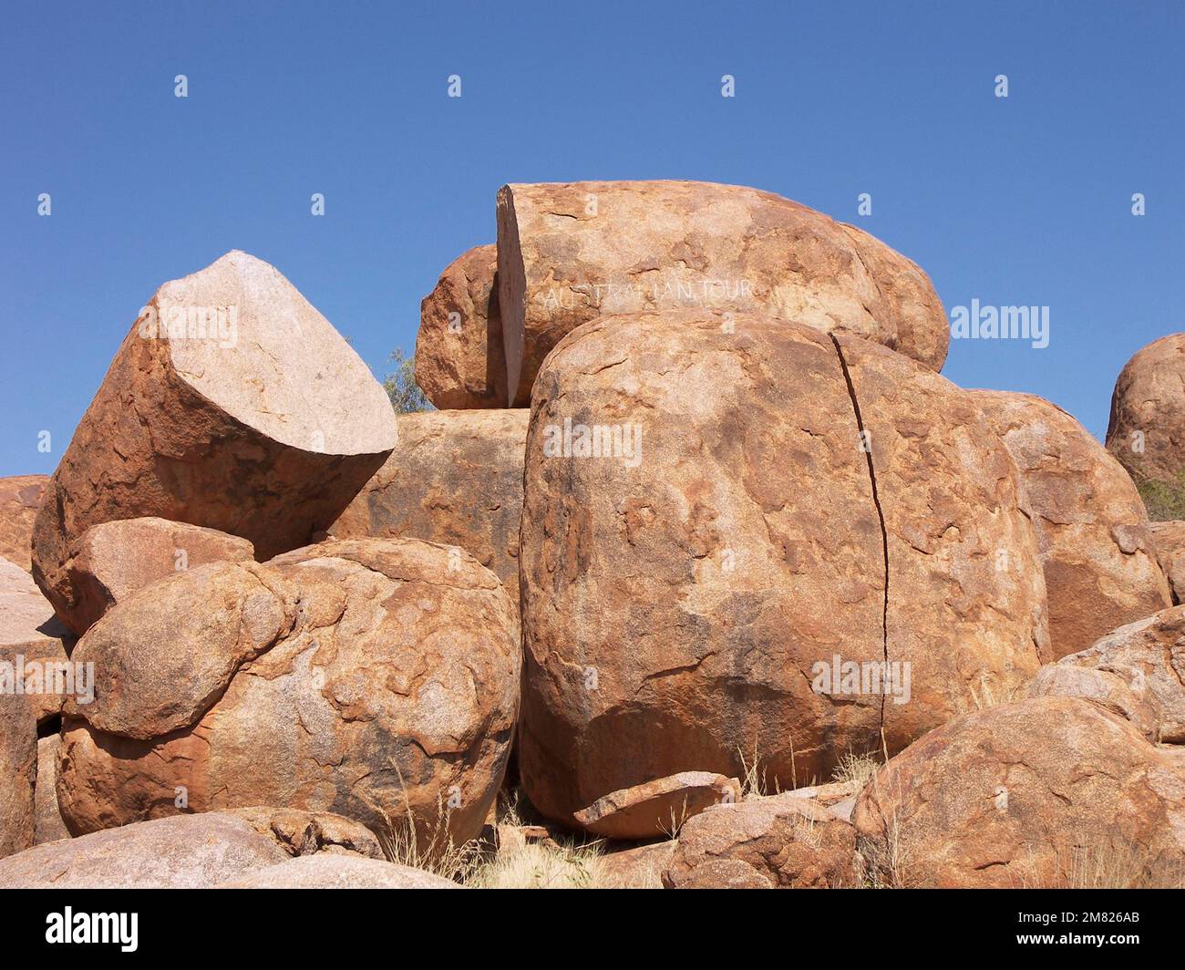The Devils Marbles lie like giant pebbles in the landscape, Australia ...
