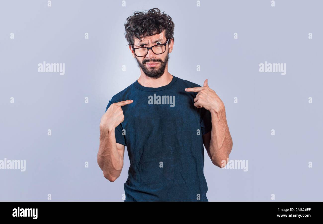 Man with puzzled face pointing at himself, person with confused gesture ...