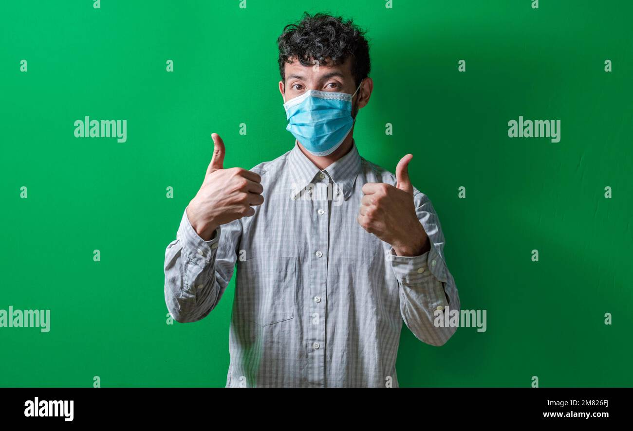 Isolated man with mask on giving thumbs up, Person giving thumbs up ...