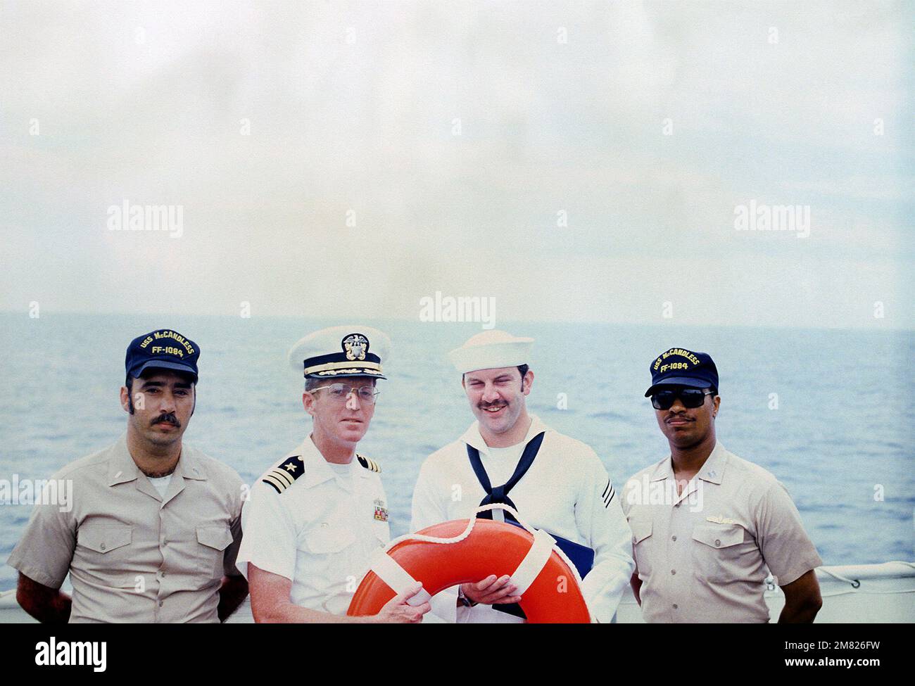 Commander G. T. Forbes, commanding officer of the USS MCCANDLESS (FF ...