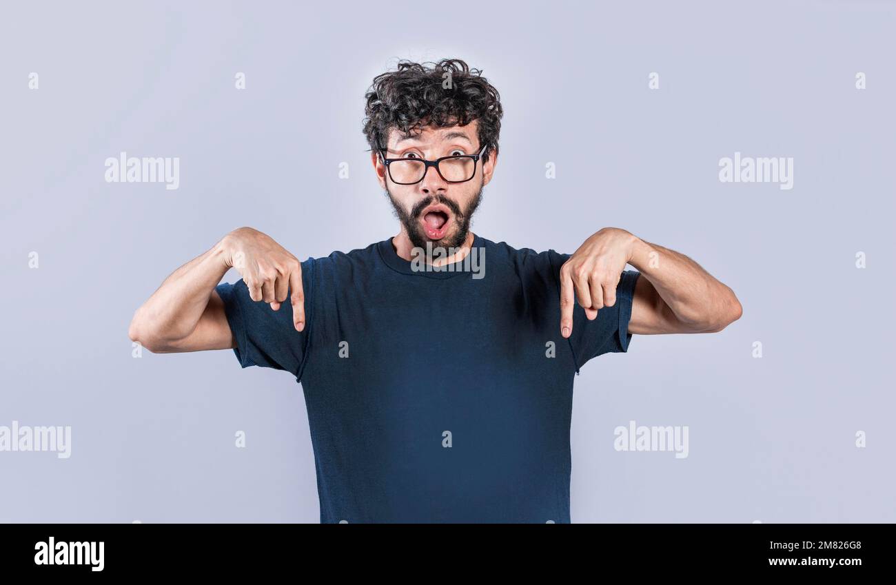 Amazed man pointing down isolated, Shocked person pointing down with ...
