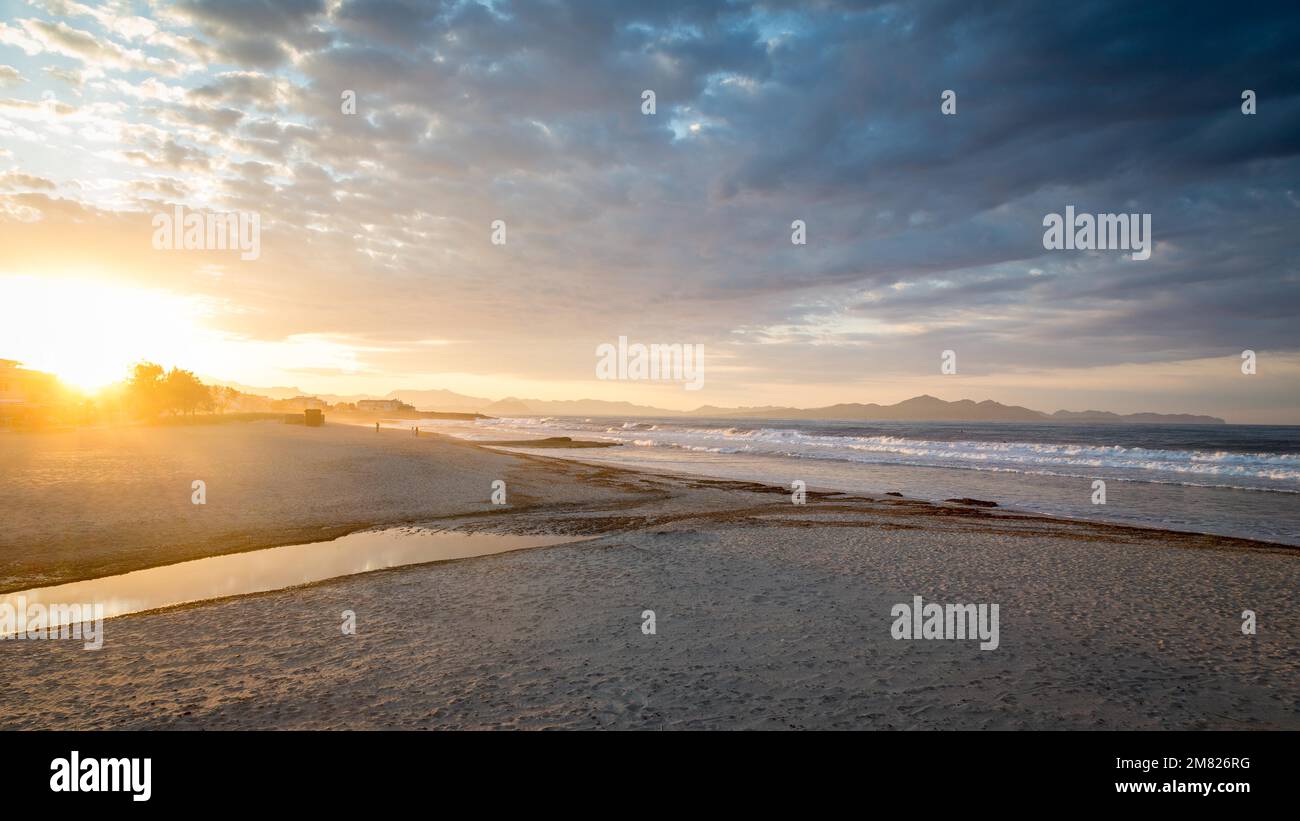 Sunset at the sandy beach playa in Son Serra de Marina, Tramuntana ...