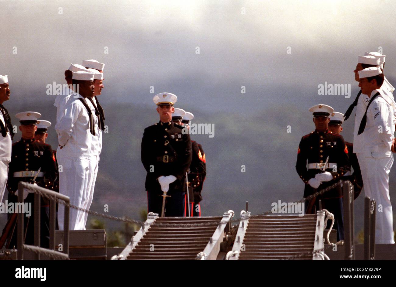 A Marine Corps honor guard stand aboard the frigate USS BREWTON (FF ...