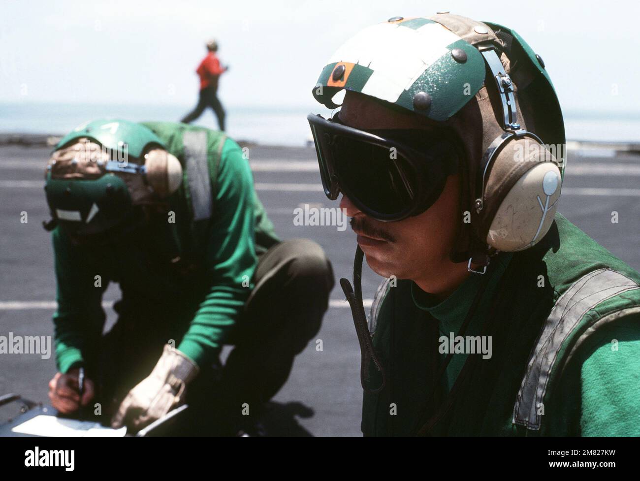 Flight deck crewman aboard the aircraft carrier USS MIDWAY (CV 41 ...