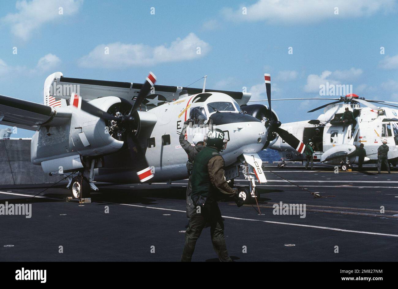A right front view of a C-1A Trader aircraft on the flight deck of the ...