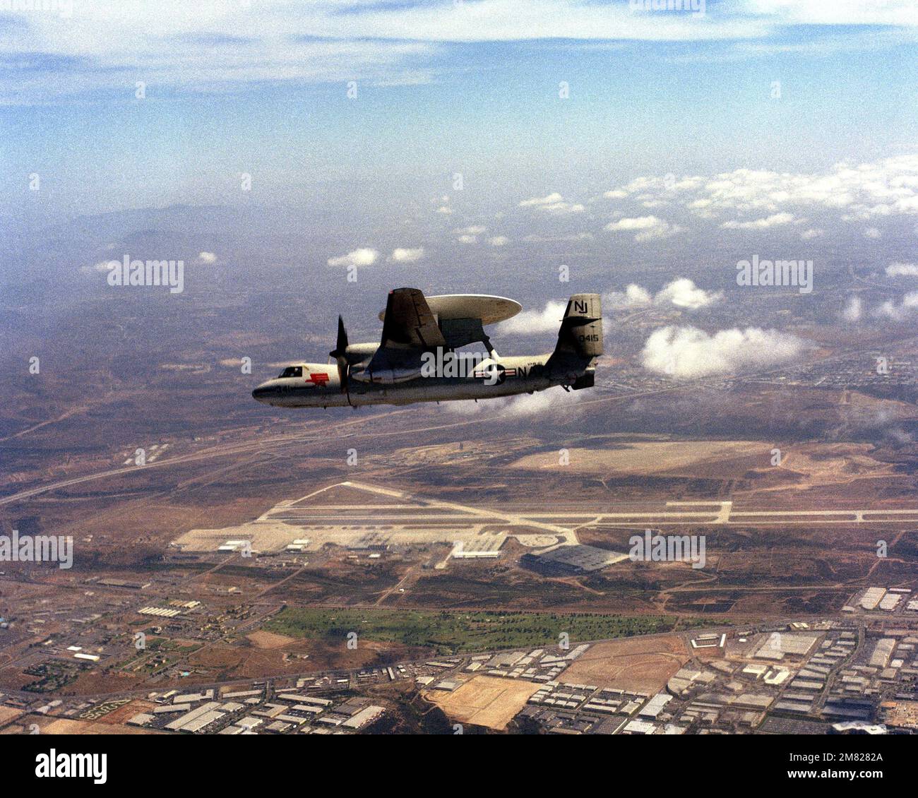 An air-to-air left side view of an E-2C Hawkeye aircraft from Airborne ...