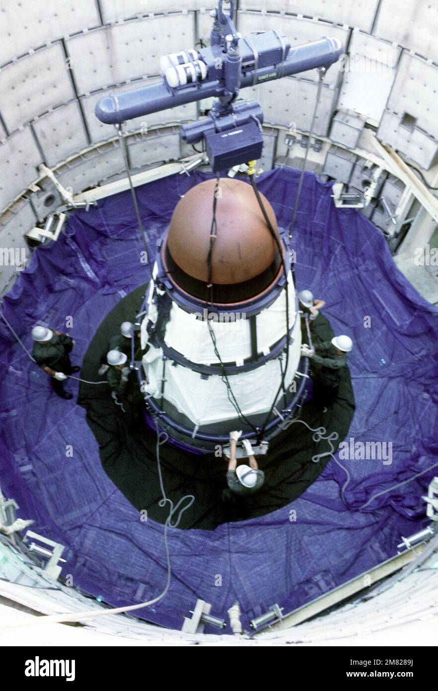 Members of the 390th Missile Maintenance Squadron secure a reentry ...