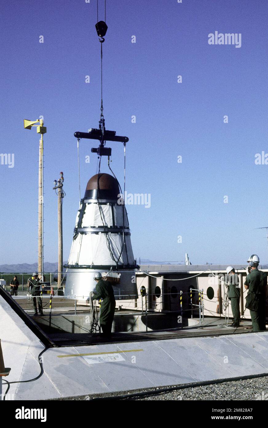 Members of the 390th Missile Maintenance Squadron guide a Titan II ...