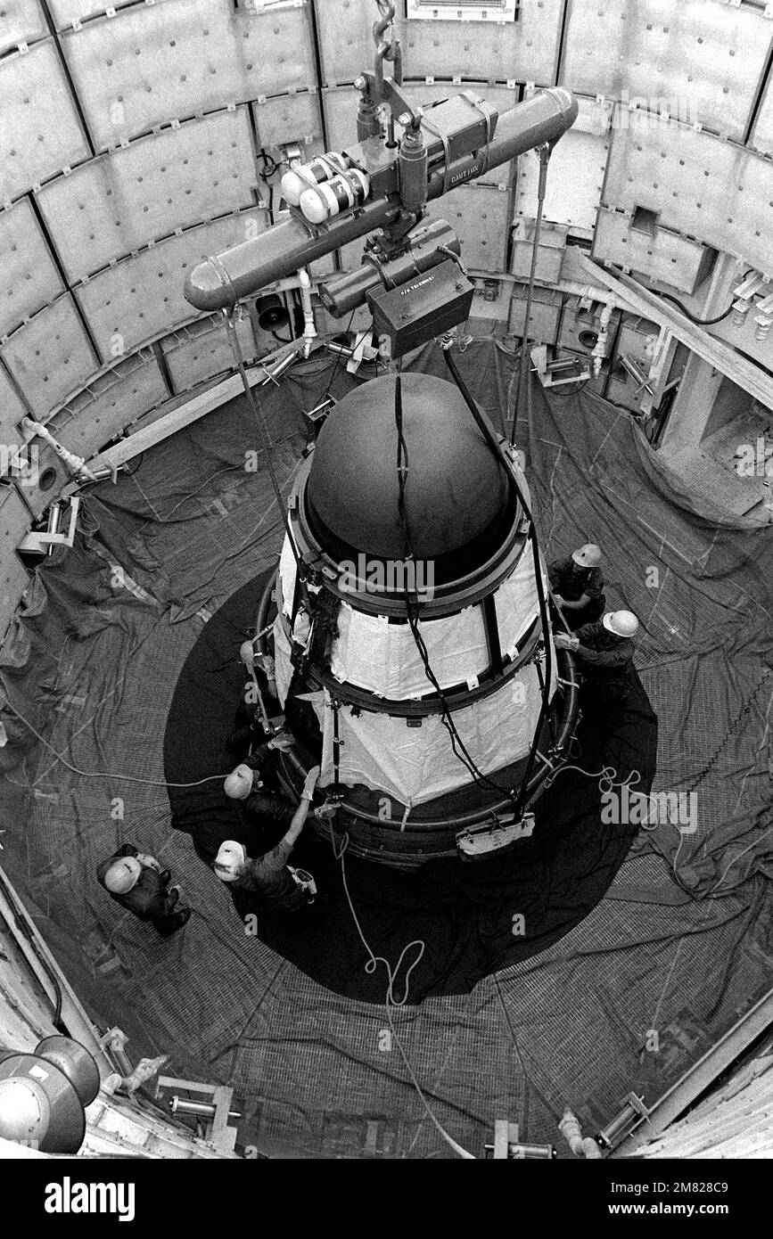 Members of the 390th Missile Maintenance Squadron secure a reentry ...