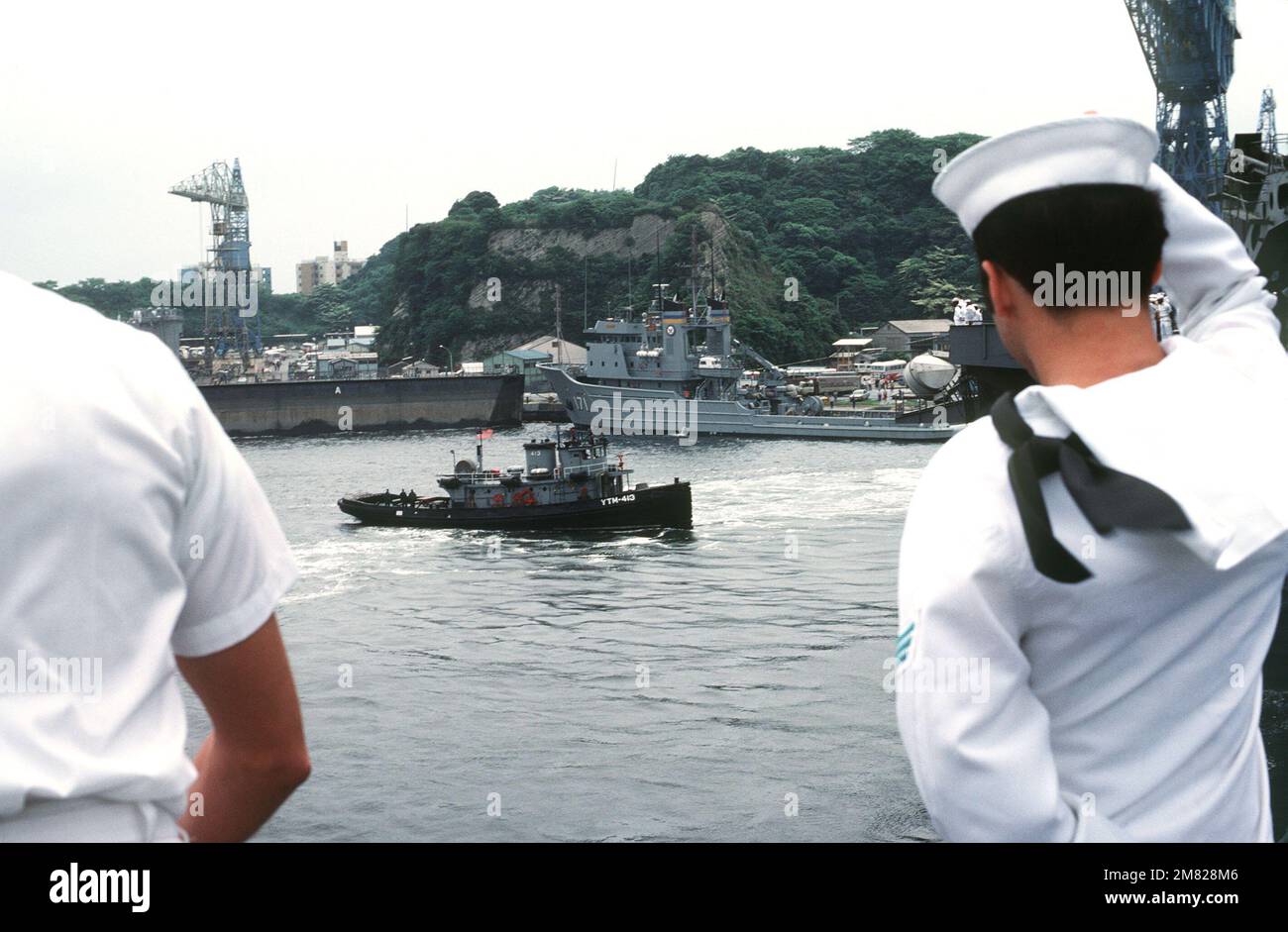 The medium harbor tug USS POROBAGO (YTM 413) and fleet tug USNS SIOUX ...