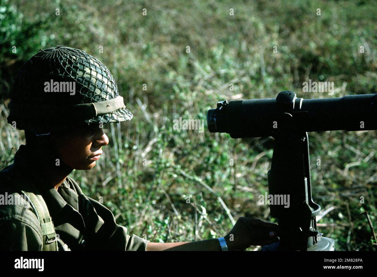 A Honduran soldier makes an adjustment on an M1 infinity aiming ...