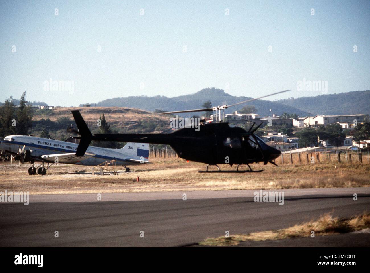 A right side view of an OH-58 Kiowa helicopter in use during the US ...