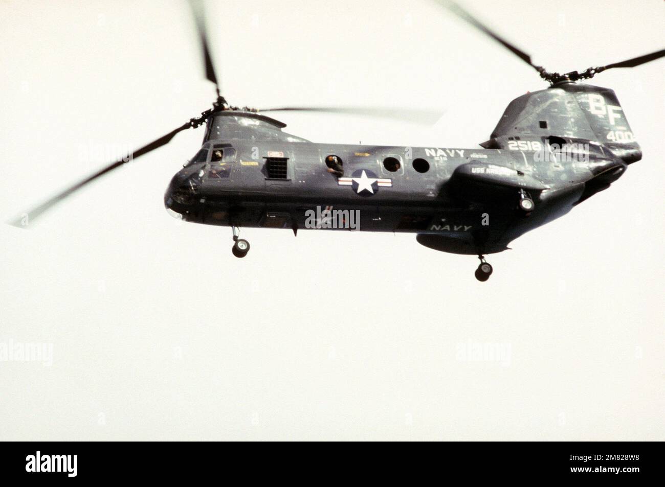 A left underside view of a CH-46 Sea Knight helicopter in use during ...