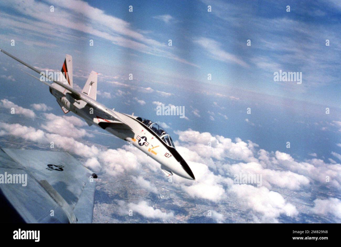 An air-to-air right side view of an F-14A Tomcat aircraft from Fighter ...