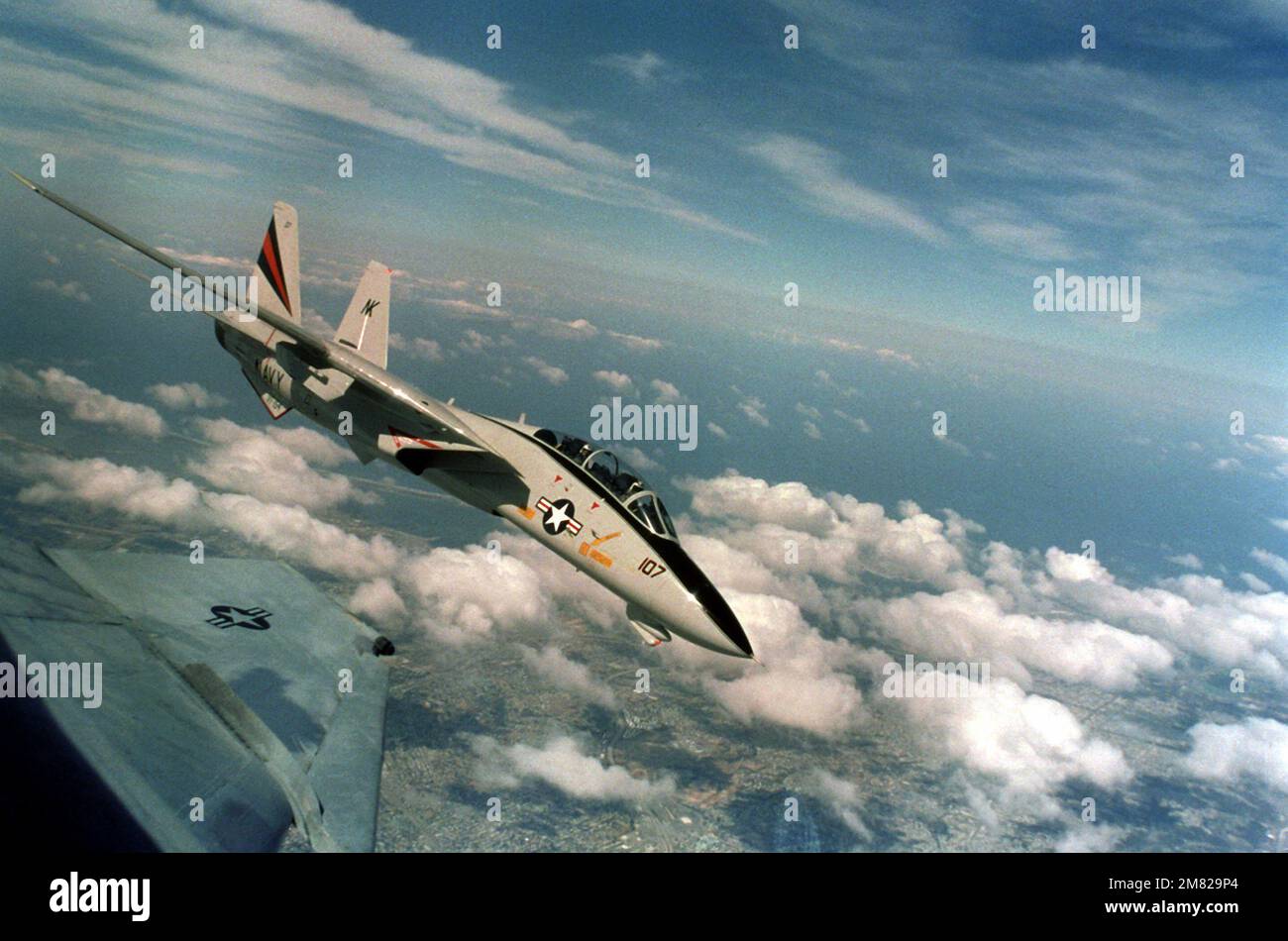 An air-to-air right side view of an F-14A Tomcat aircraft from Fighter ...