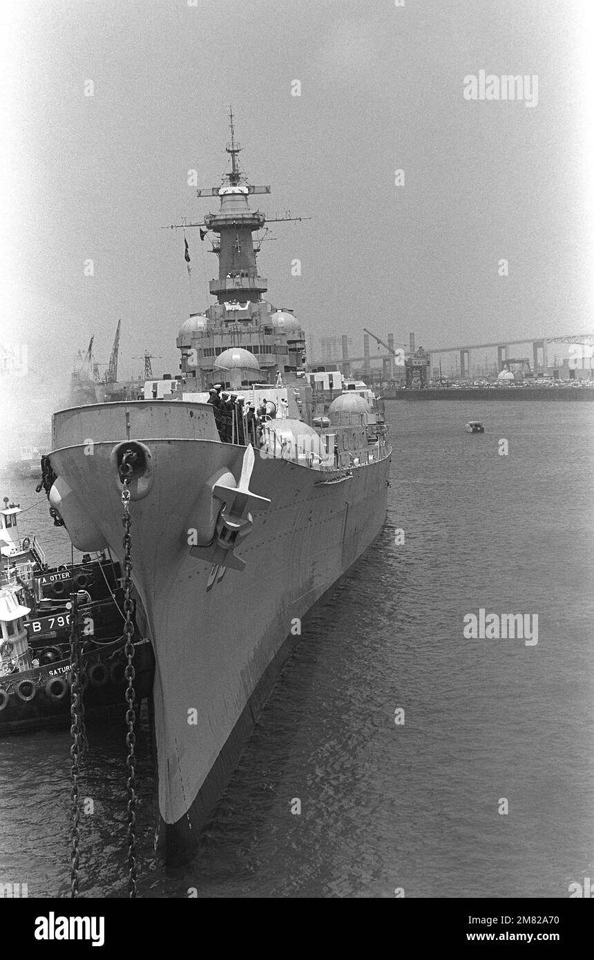 The large harbor tug USS SACO (YTB 796) and two commercial tugs guide ...