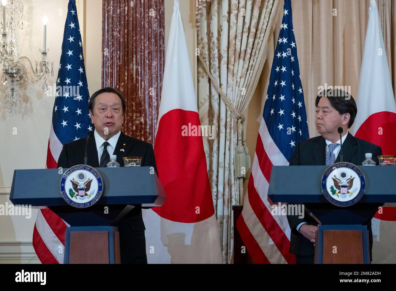 Japanese Defense Minister Yasukazu Hamada, left, speaks as Japanese ...