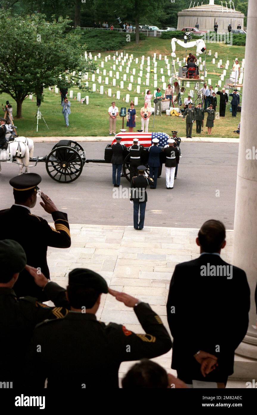 Pallbearers prepare to lift the casket bearing the remains of the ...