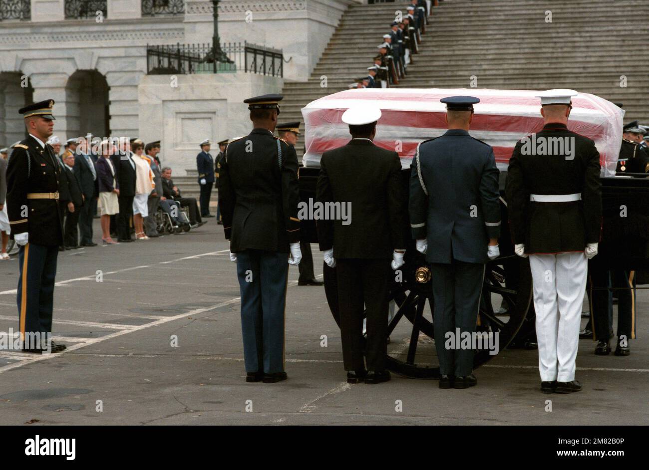 A joint services casket team prepares to secure the casket of the Unknown Serviceman of the ...