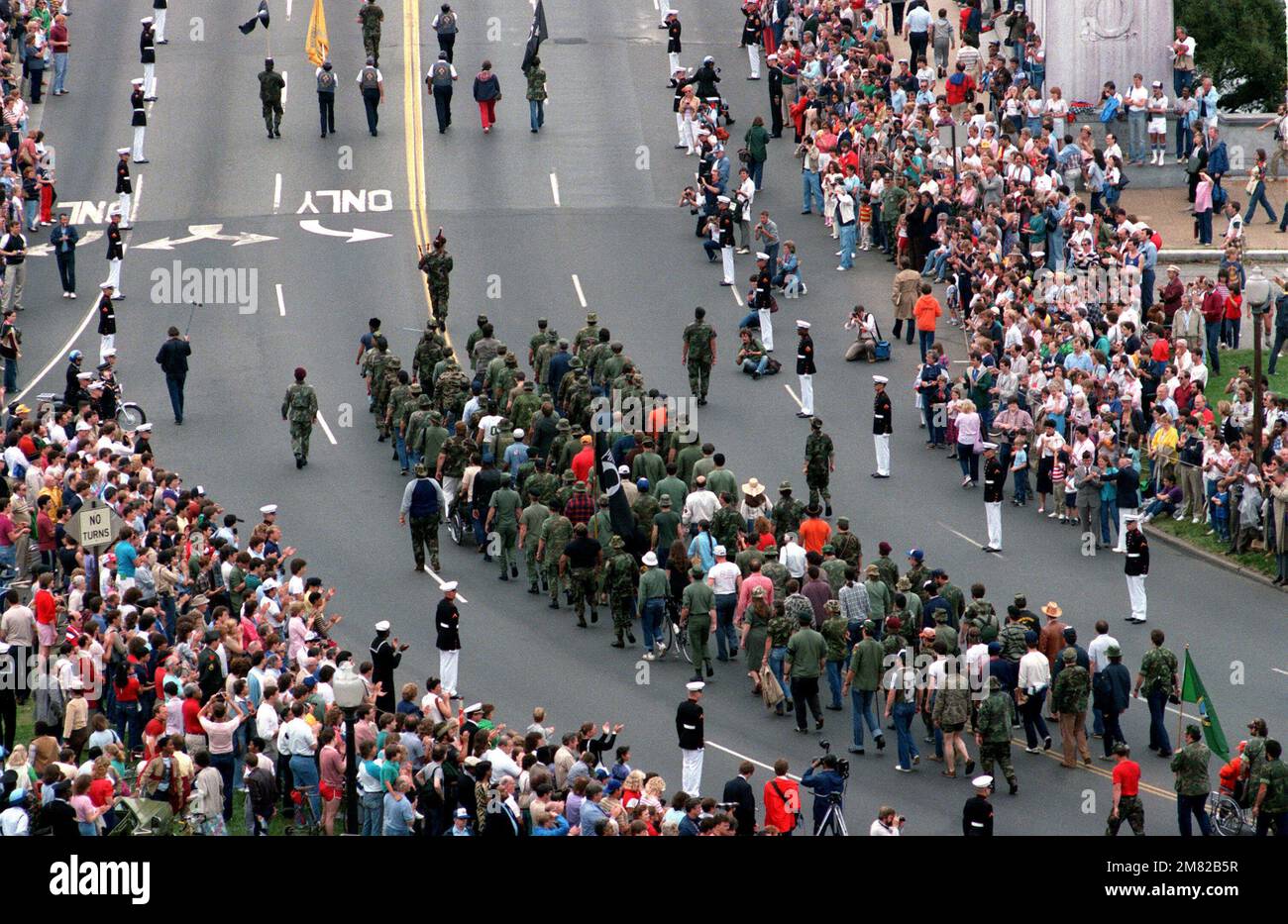 Overhead view of Vietnam Veterans marching in the funeral procession ...