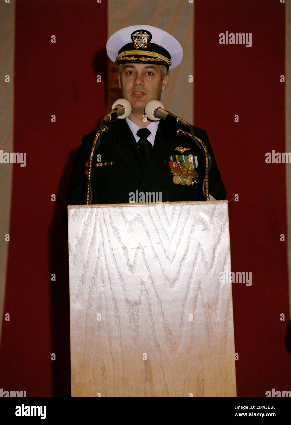Commander (CDR) Victor E. Dobbs speaks during the ceremony in which he ...