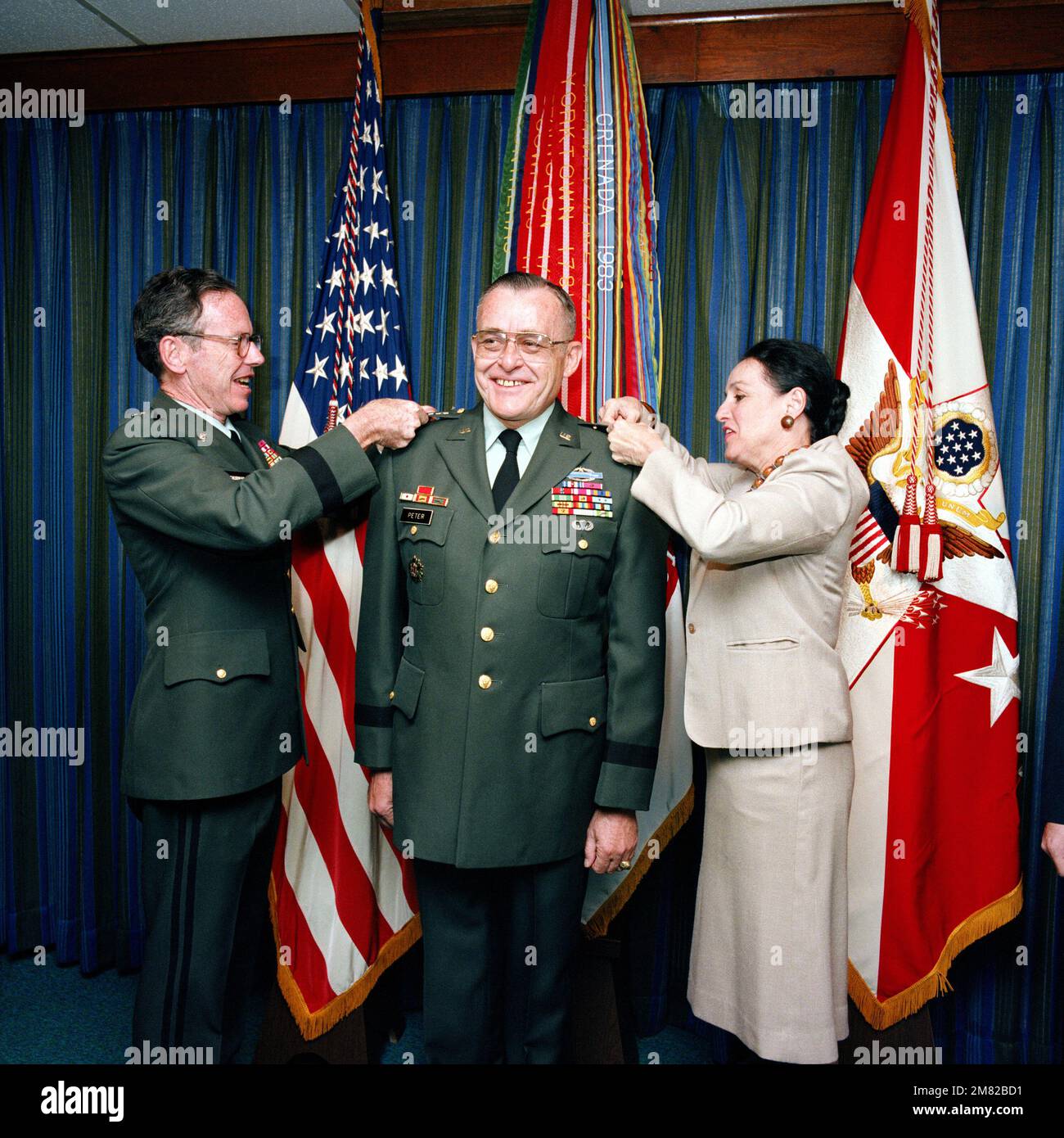 Lieutenant General Edward C. Peter stands at attention as his wife and ...