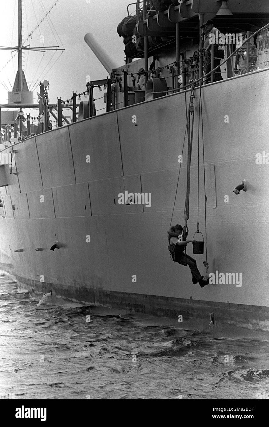 A sailor from the Deck Department of the battleship USS IOWA (BB-61 ...