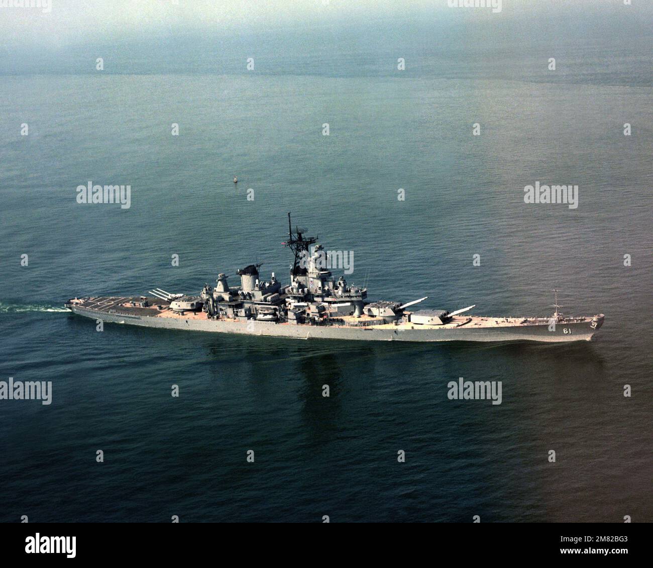 An elevated starboard bow view of the battleship USS IOWA (BB 61) underway. (Substandard image ...