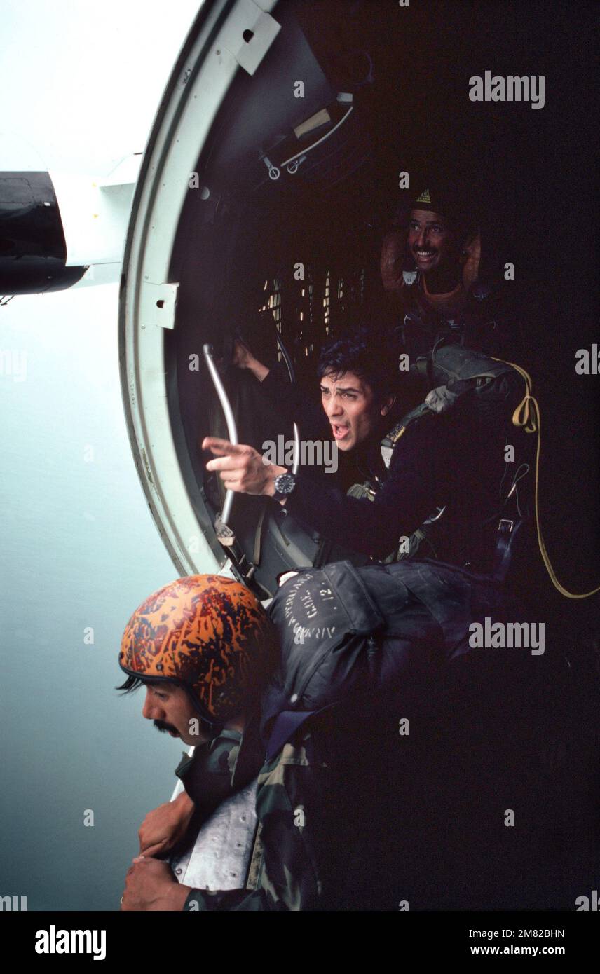 Members of a joint US/Peruvian special warfare team spot the drop zone ...