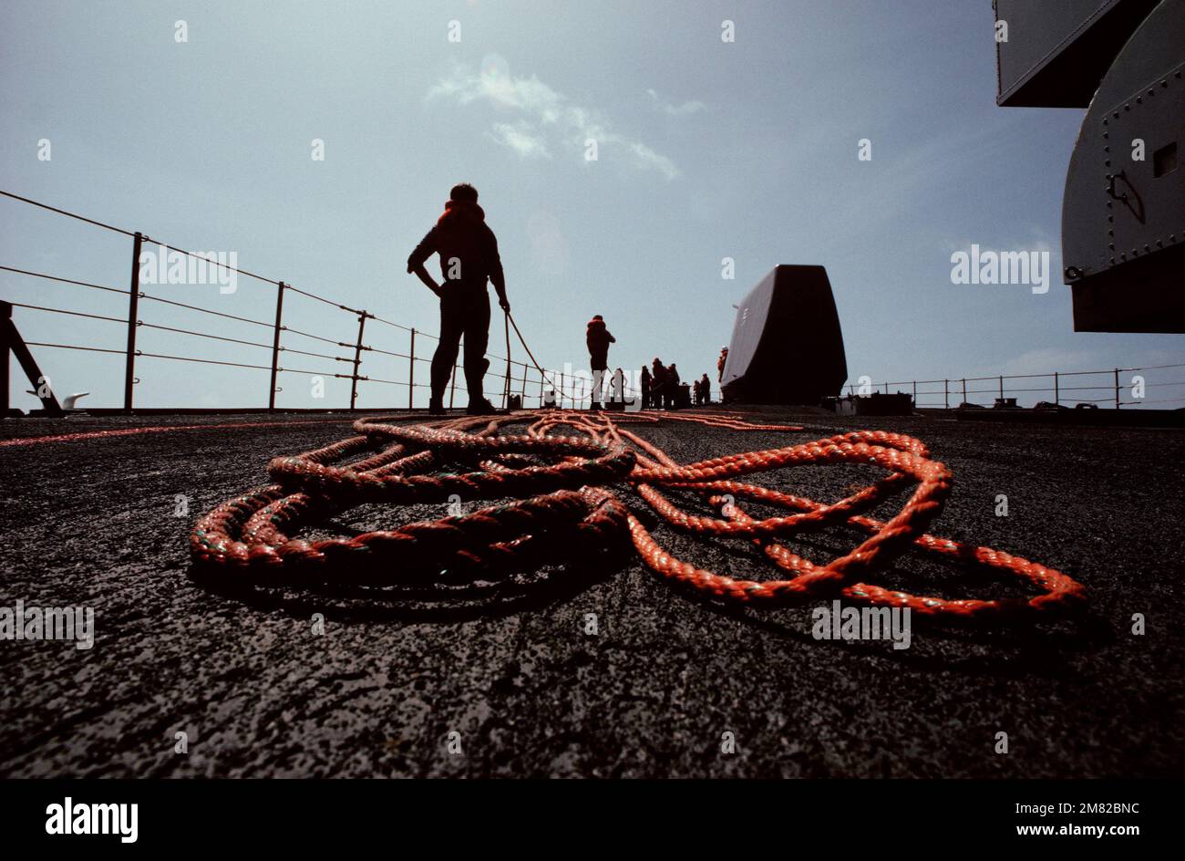 Crewmen aboard the destroyer USS THORN (DD 988) prepare lines for an ...