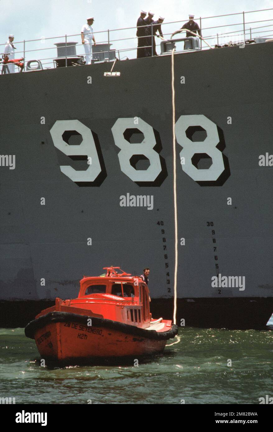 A mooring line from the destroyer USS THORN (DD 988) is transported to ...