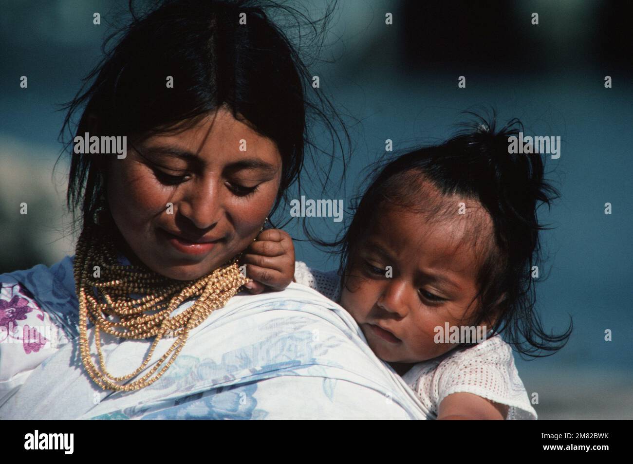 A mother and child at an open-air market. Base: Manta Country: Ecuador ...
