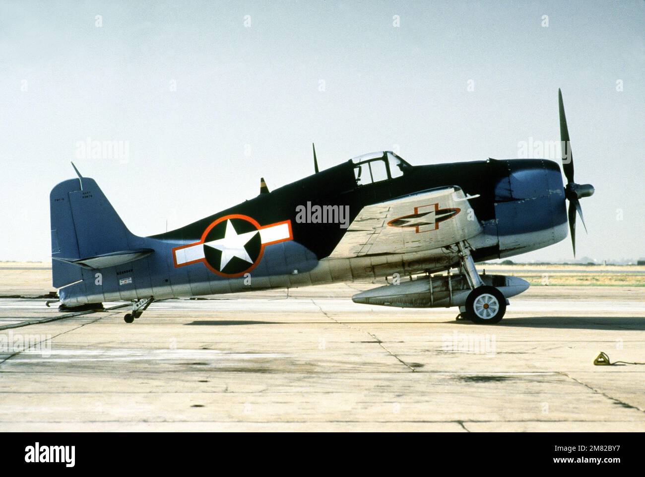 Right side view of a restored F-6F Hellcat aircraft parked on the ...