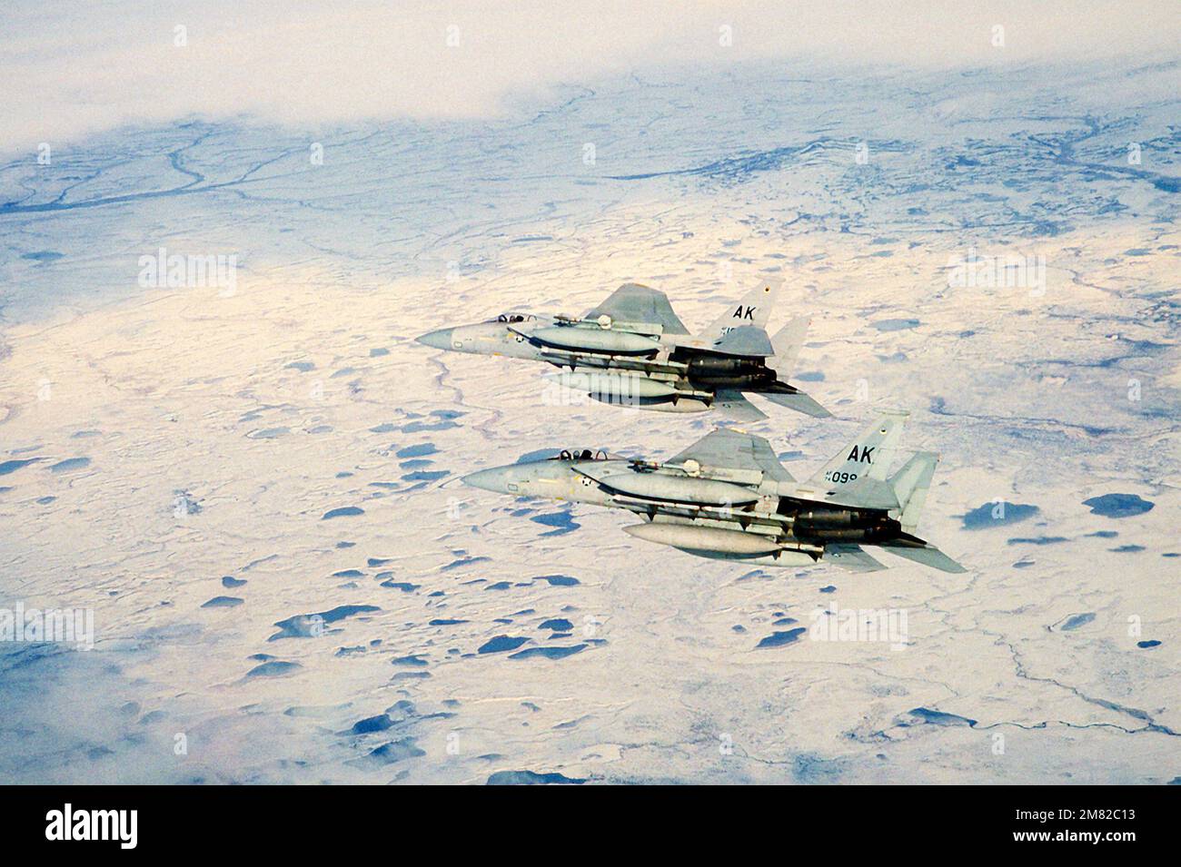 Air-to-air left side view of two F-15 Eagle aircraft of the 43rd ...