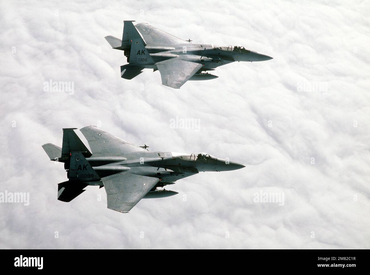 Air-to-air right view of two F-15 Eagle aircraft of the 43rd Tactical ...