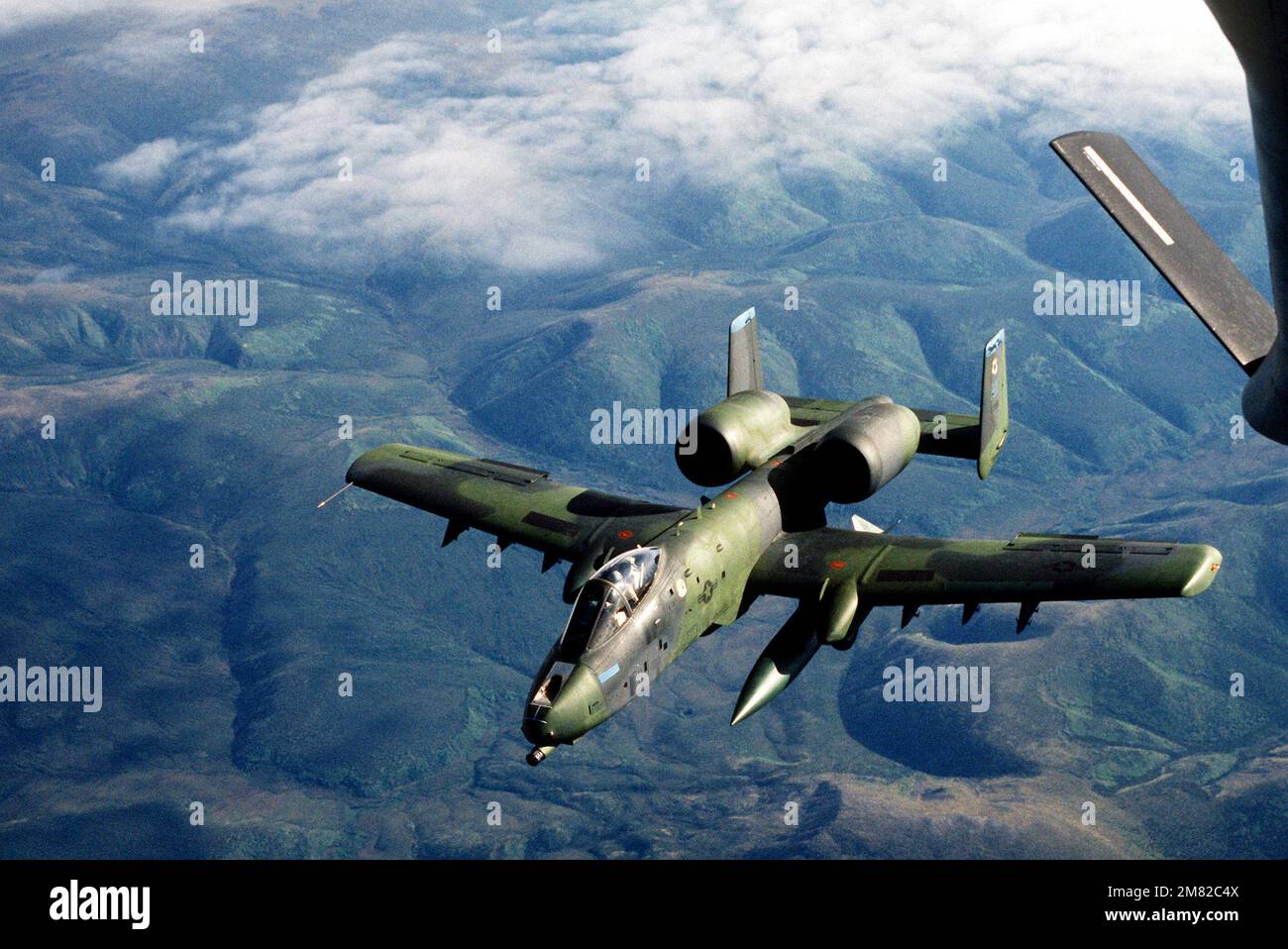Air-to-air left front view of an A-10 Thunderbolt aircraft of the 18th ...