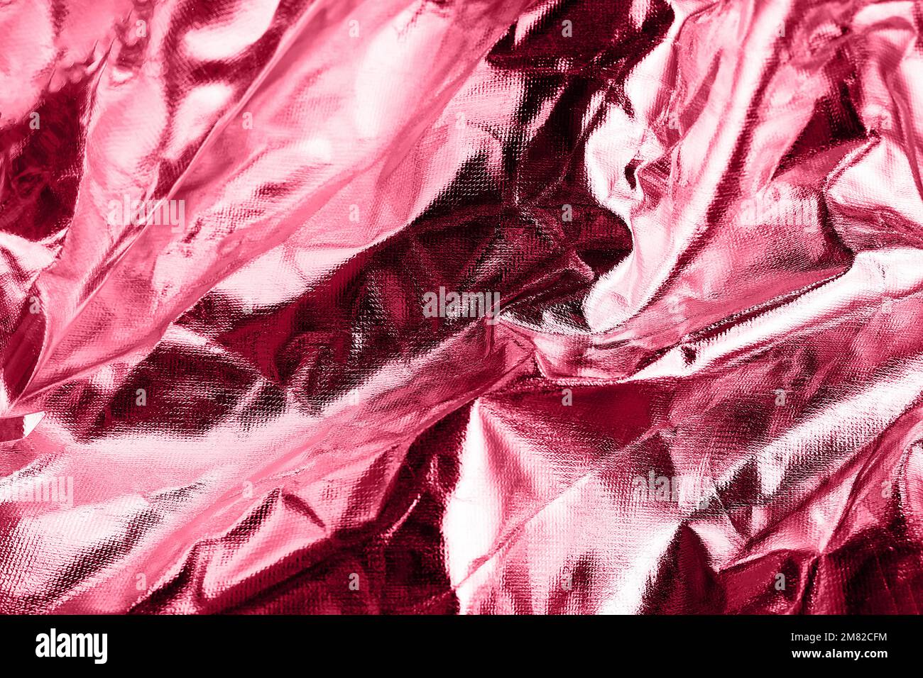 Shiny crumpled foil surface for textured background toned in trendy ...