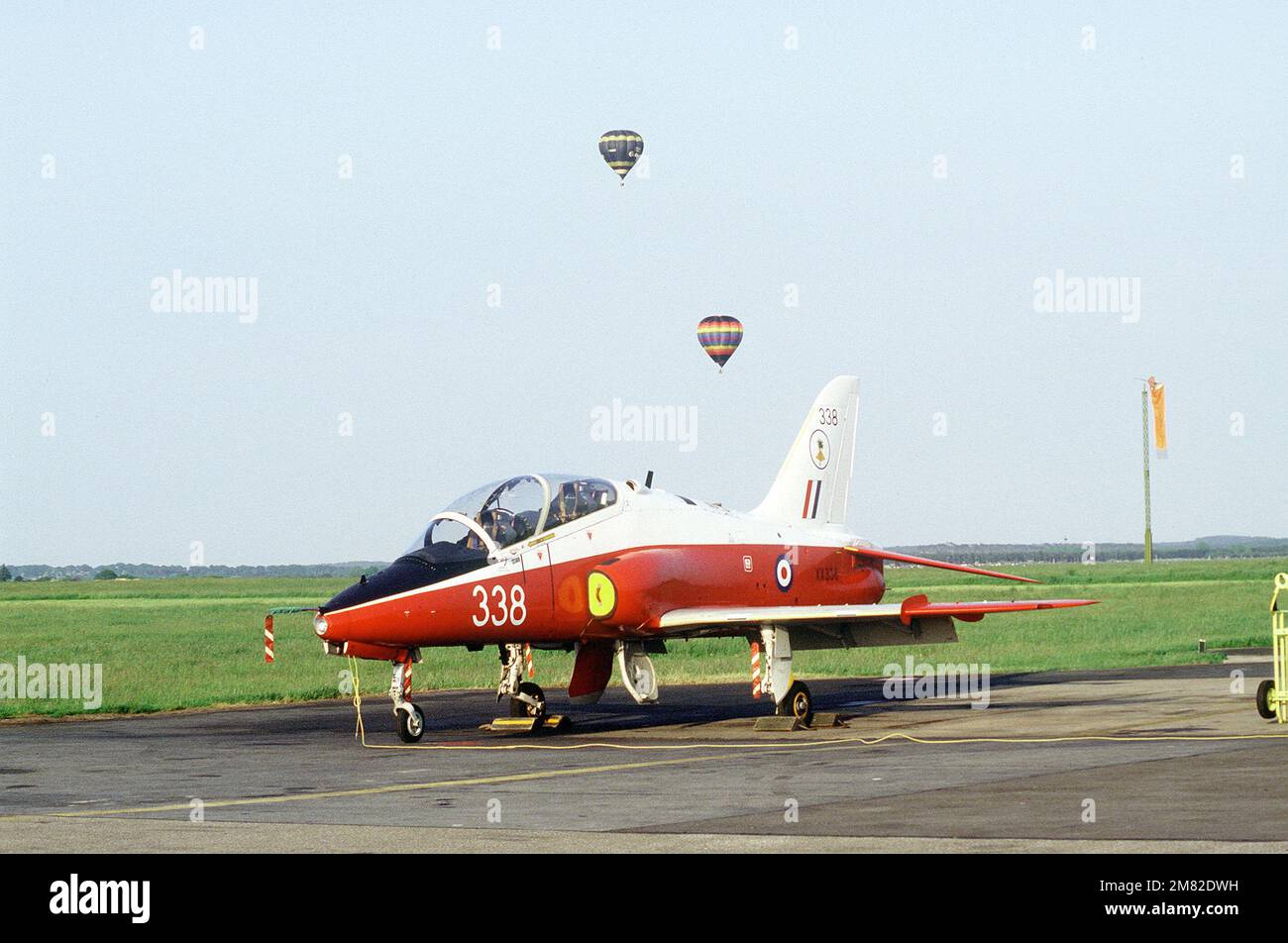 A BAe Hawk aircraft parked on the flight line during Air Fete '84. Two ...