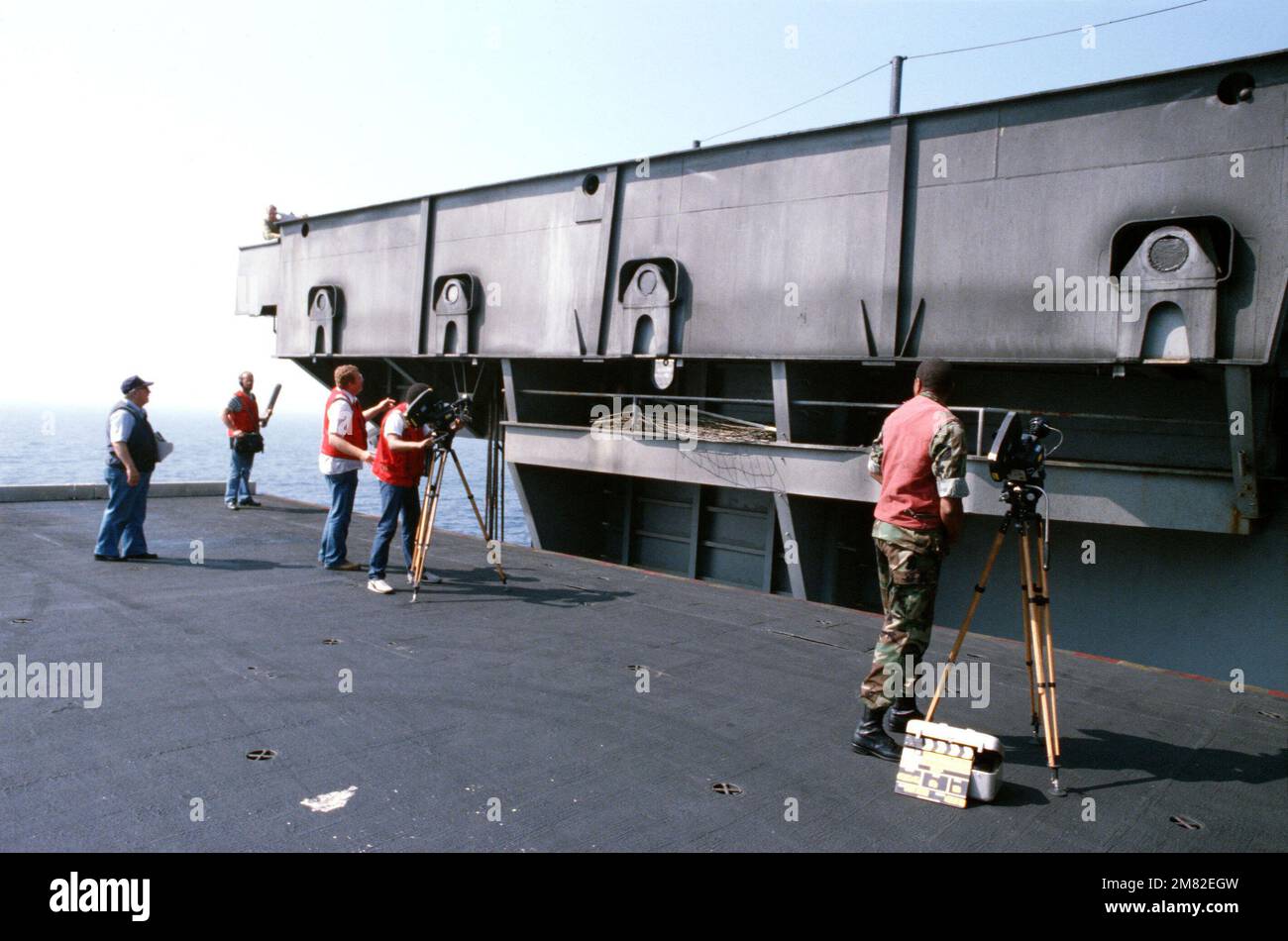 A motion picture crew from the Naval Audiovisual Center shoots footage ...