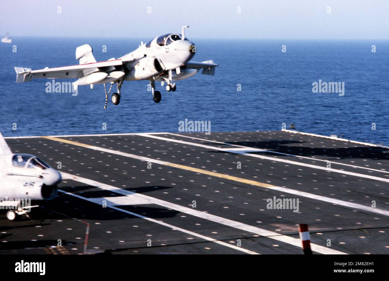 A right front view of an EA-6B Prowler aircraft landing on the flight ...