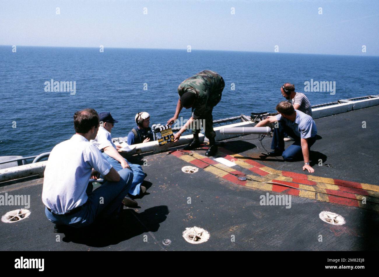 A crew from the Naval Audiovisual Center prepares to shoot motion ...